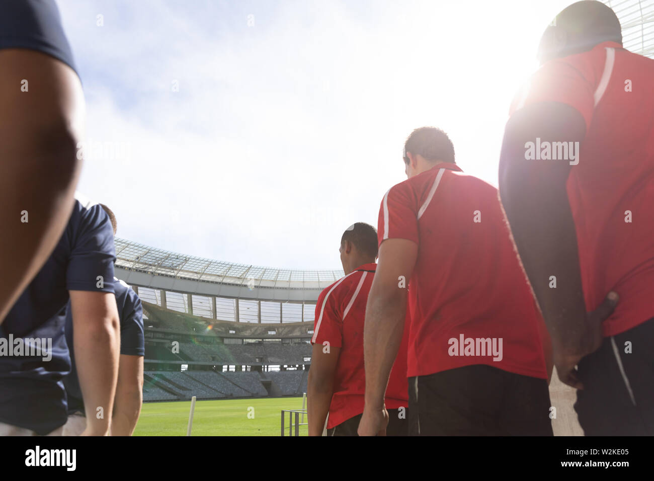 Male rugby players standing in a row at stadium for match Stock Photo ...