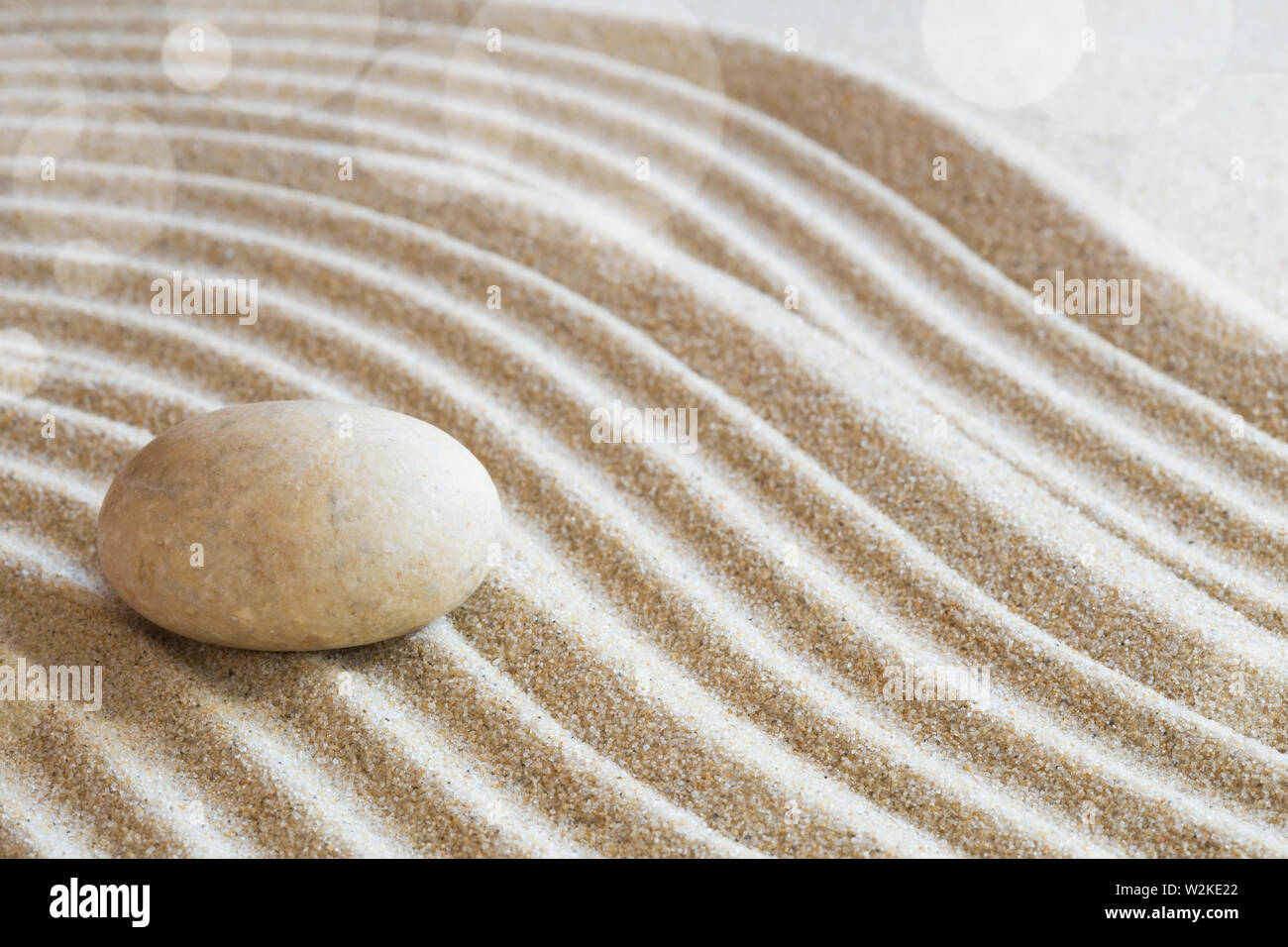 Rock on sand hi-res stock photography and images - Alamy