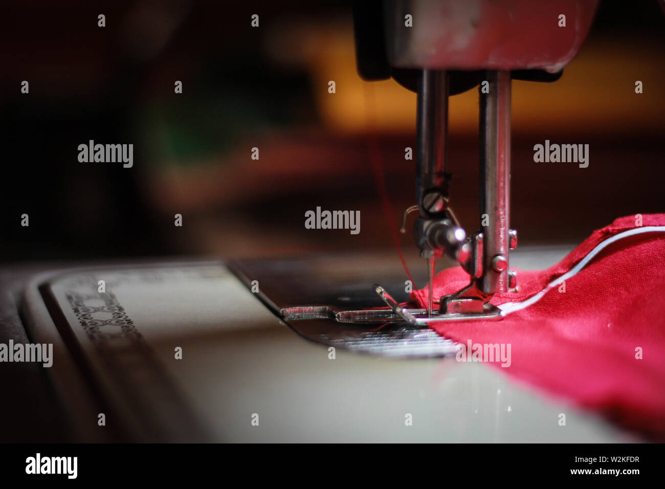 sewing machine with red thread and needle Stock Photo - Alamy