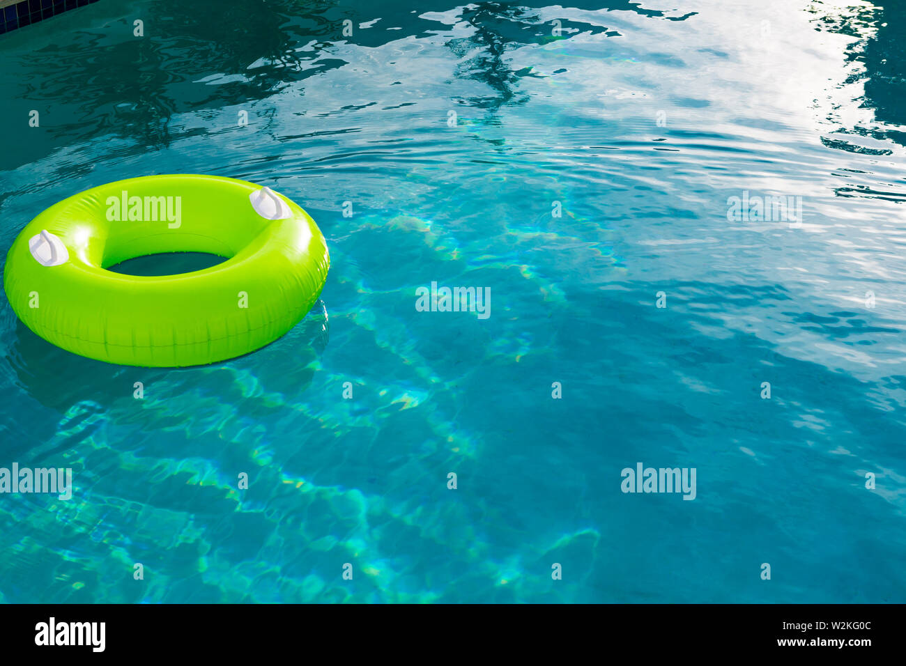 Inflatable tube floating in a swimming pool in backyard Stock Photo - Alamy