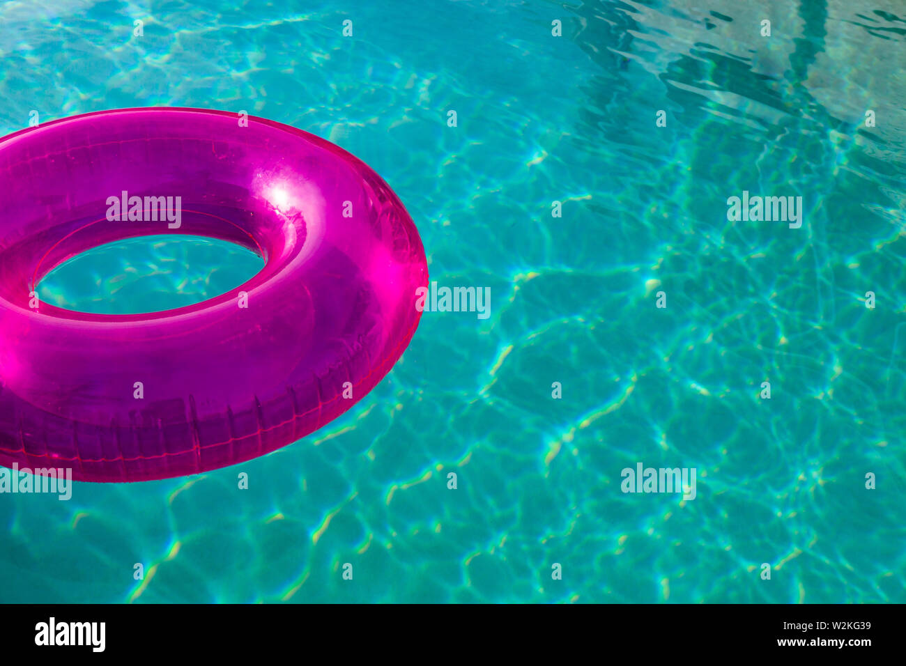 Inflatable tube floating in a swimming pool in backyard Stock Photo - Alamy