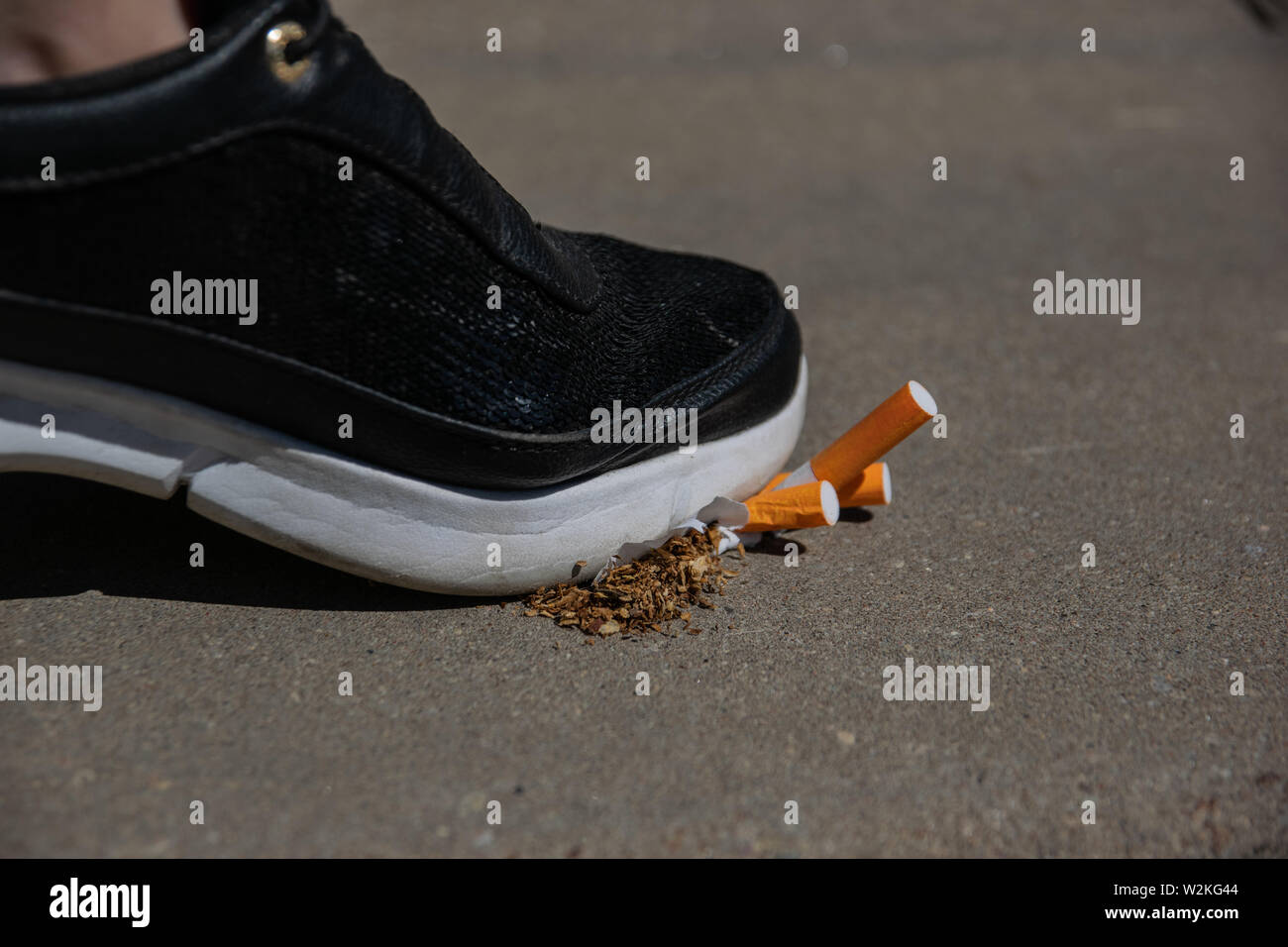 Tramples cigarettes stop smoking concept hi-res stock photography and ...