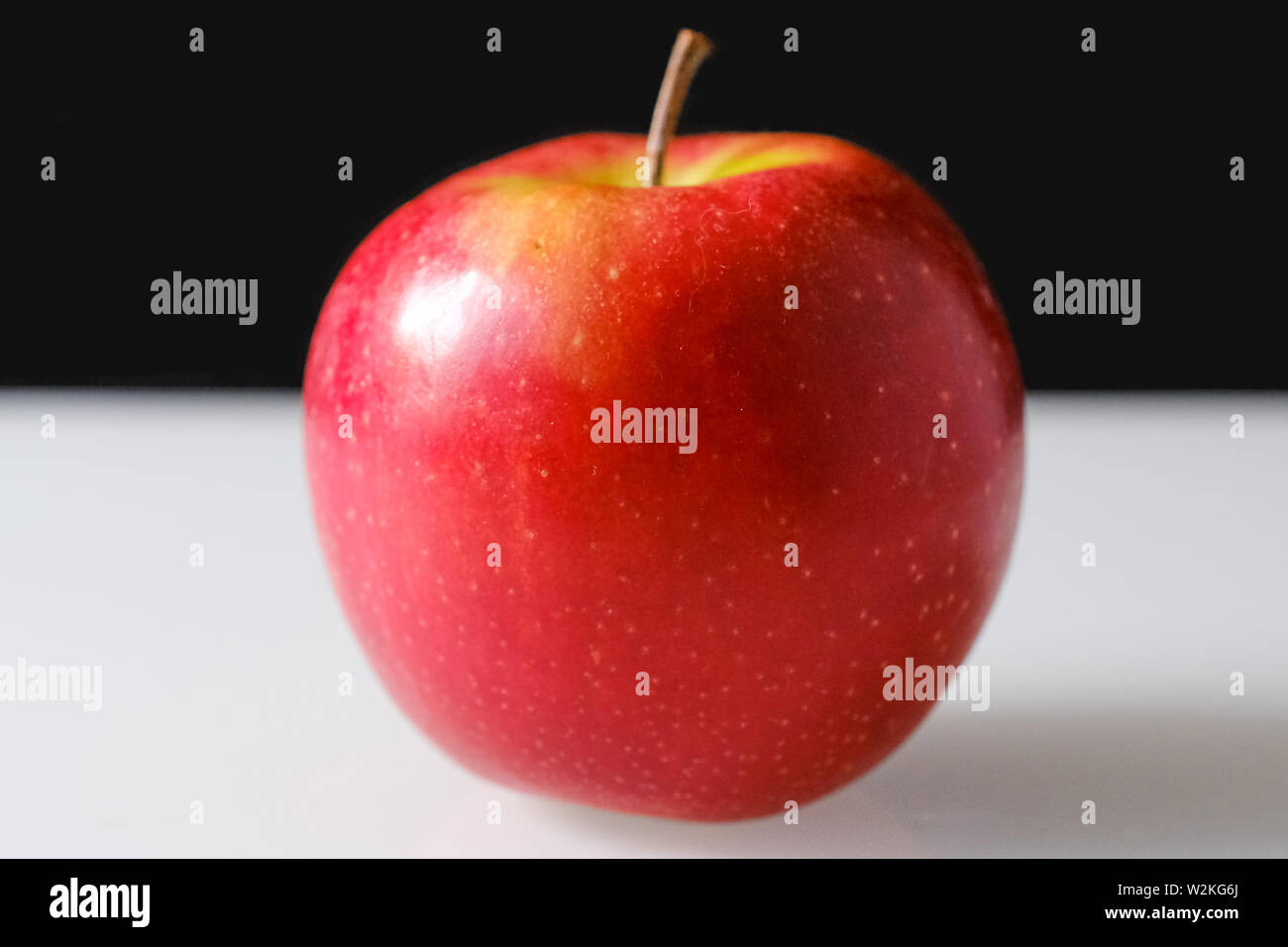 red apple on the black and white background Stock Photo - Alamy