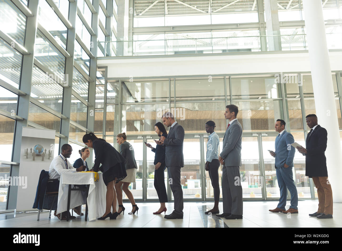 Business people queuing hi-res stock photography and images - Alamy