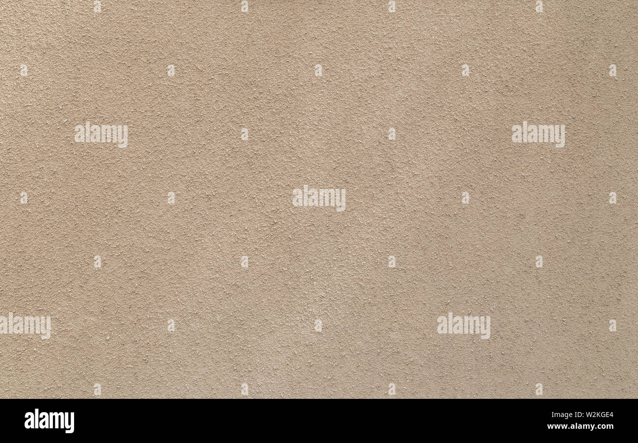 Plastered, painted, rough and beige or light brown concrete or stone ...