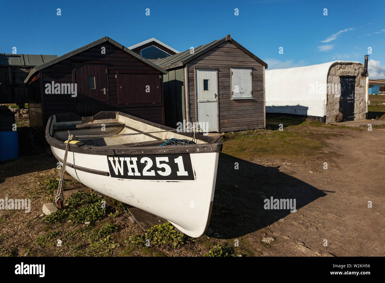 Beach huts and a boat in Portland (Dorset, UK Stock Photo - Alamy