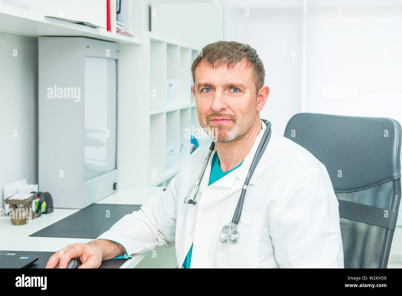 Close up Portrait of male mature doctor feeling confident in himself ...