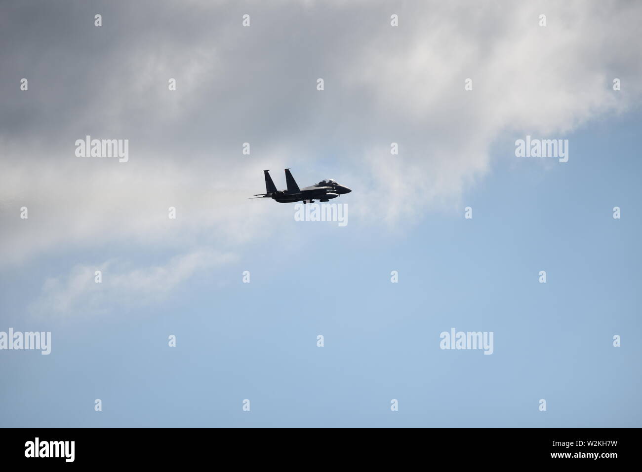 f 15 eagle jet fighter USAF flying past against a cloudy sky Stock ...