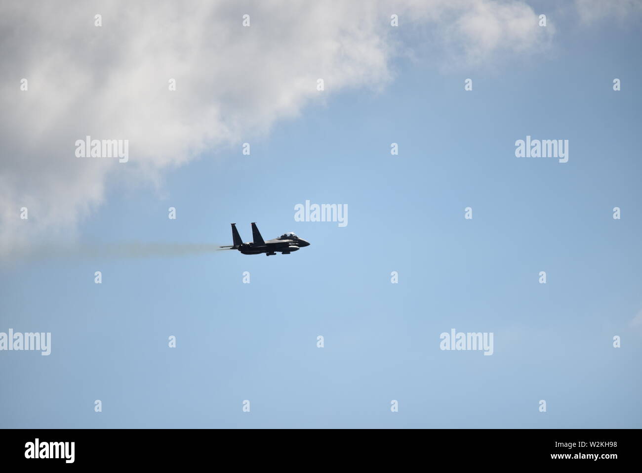 f 15 eagle jet fighter USAF flying past against a cloudy sky Stock ...