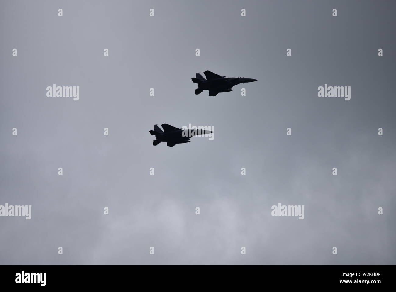 f 15 eagle jet fighter USAF flying past against a cloudy sky Stock ...