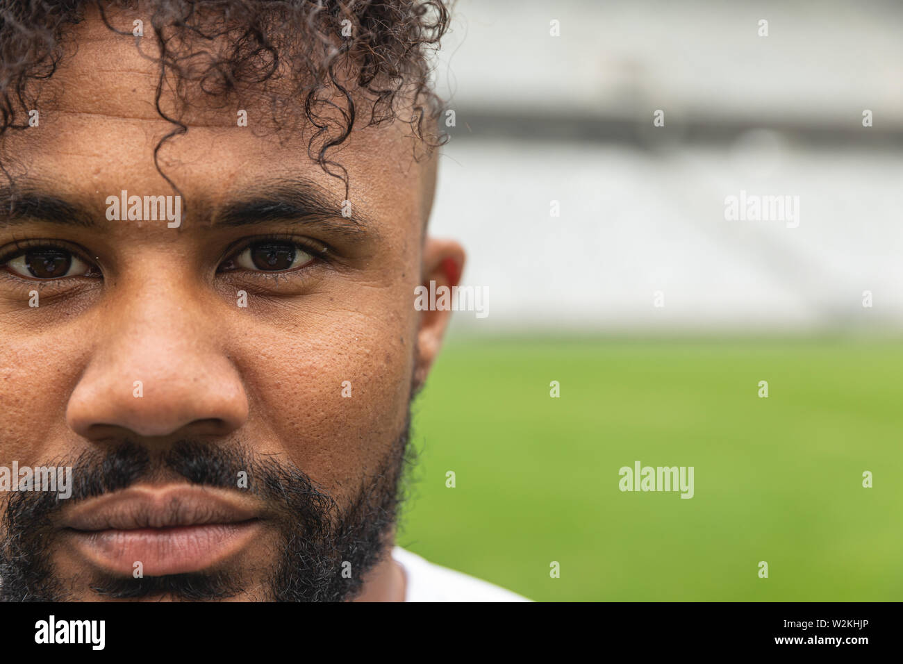 African american rugby player looking at camera in the stadium Stock ...