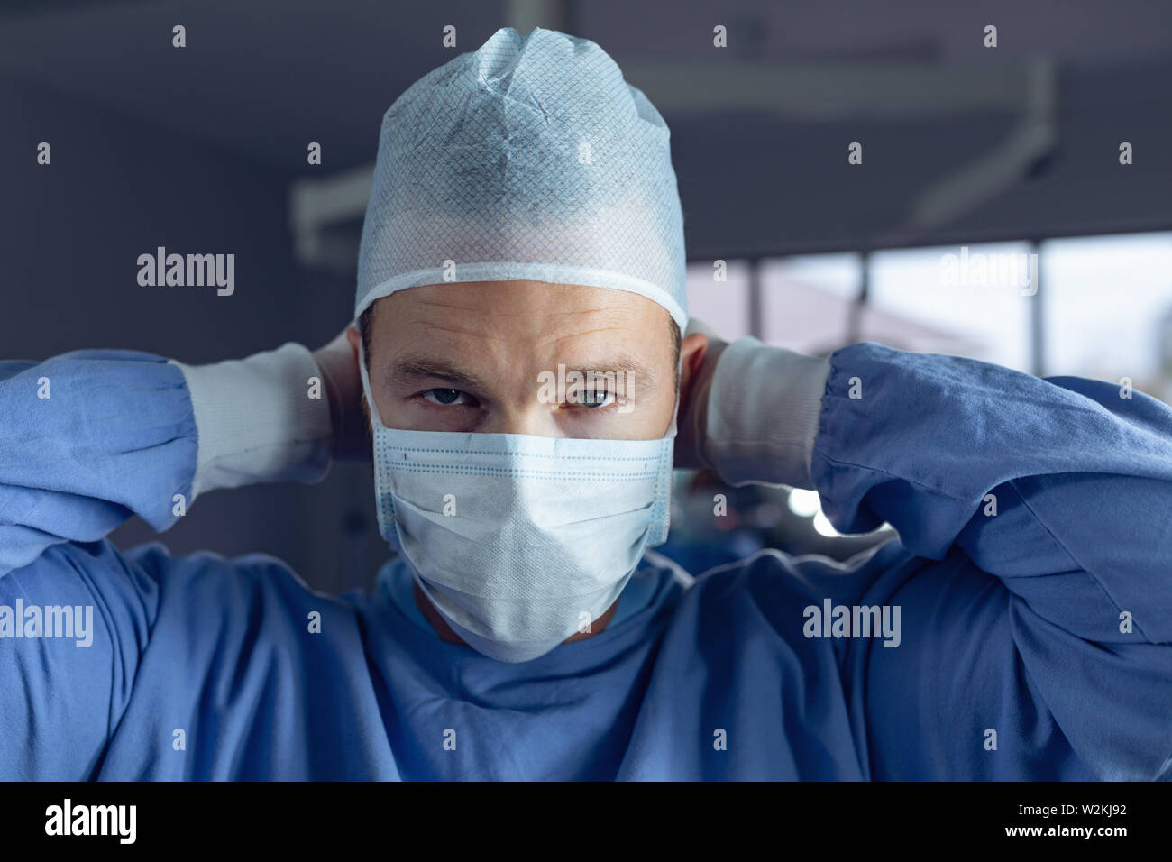 Male surgeon wearing surgical mask in operation room at hospital Stock ...