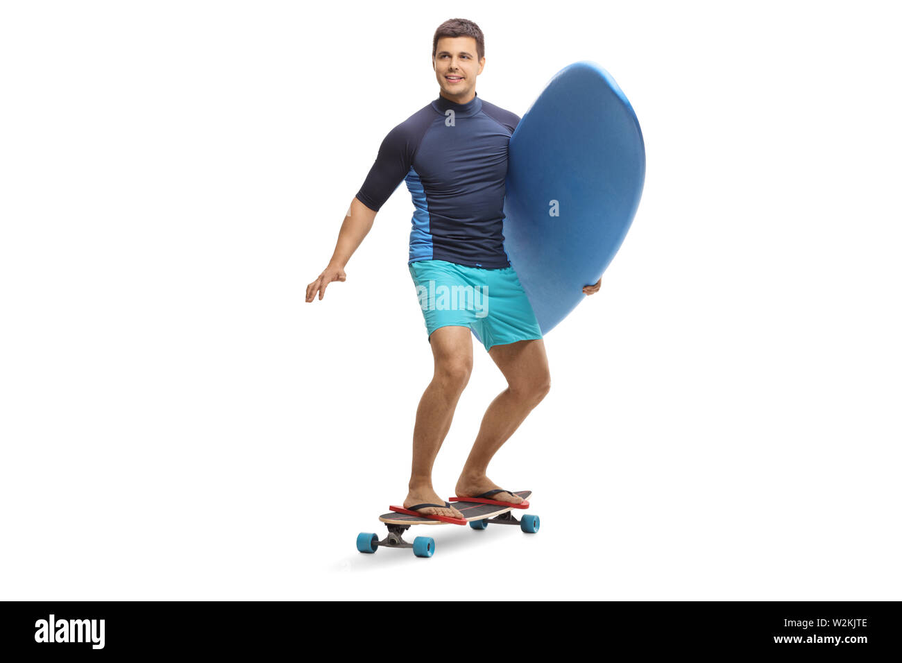 Surfer carrying his surfboard Cut Out Stock Images & Pictures - Alamy