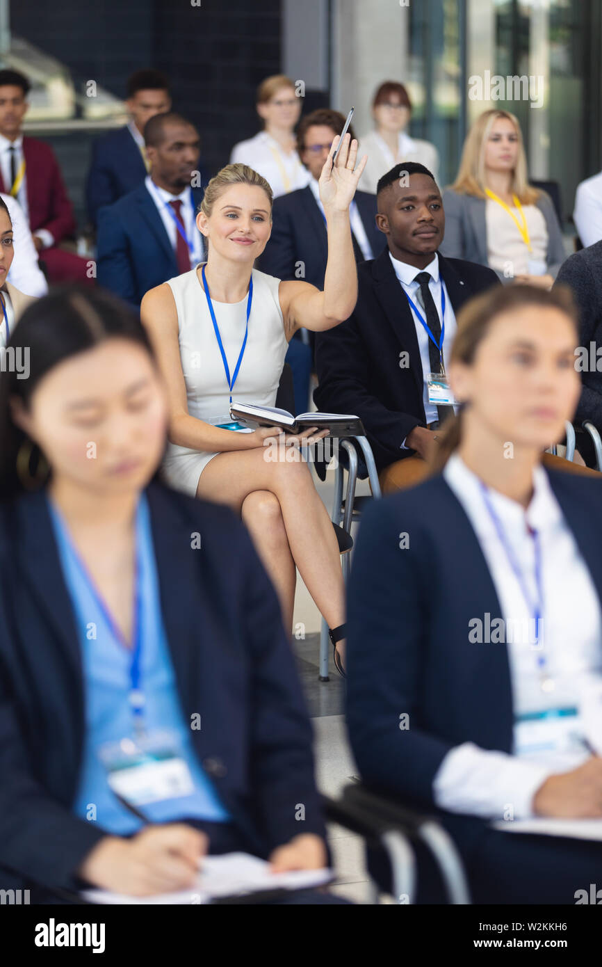 Young Businesswoman asking question in speech in conference room Stock ...