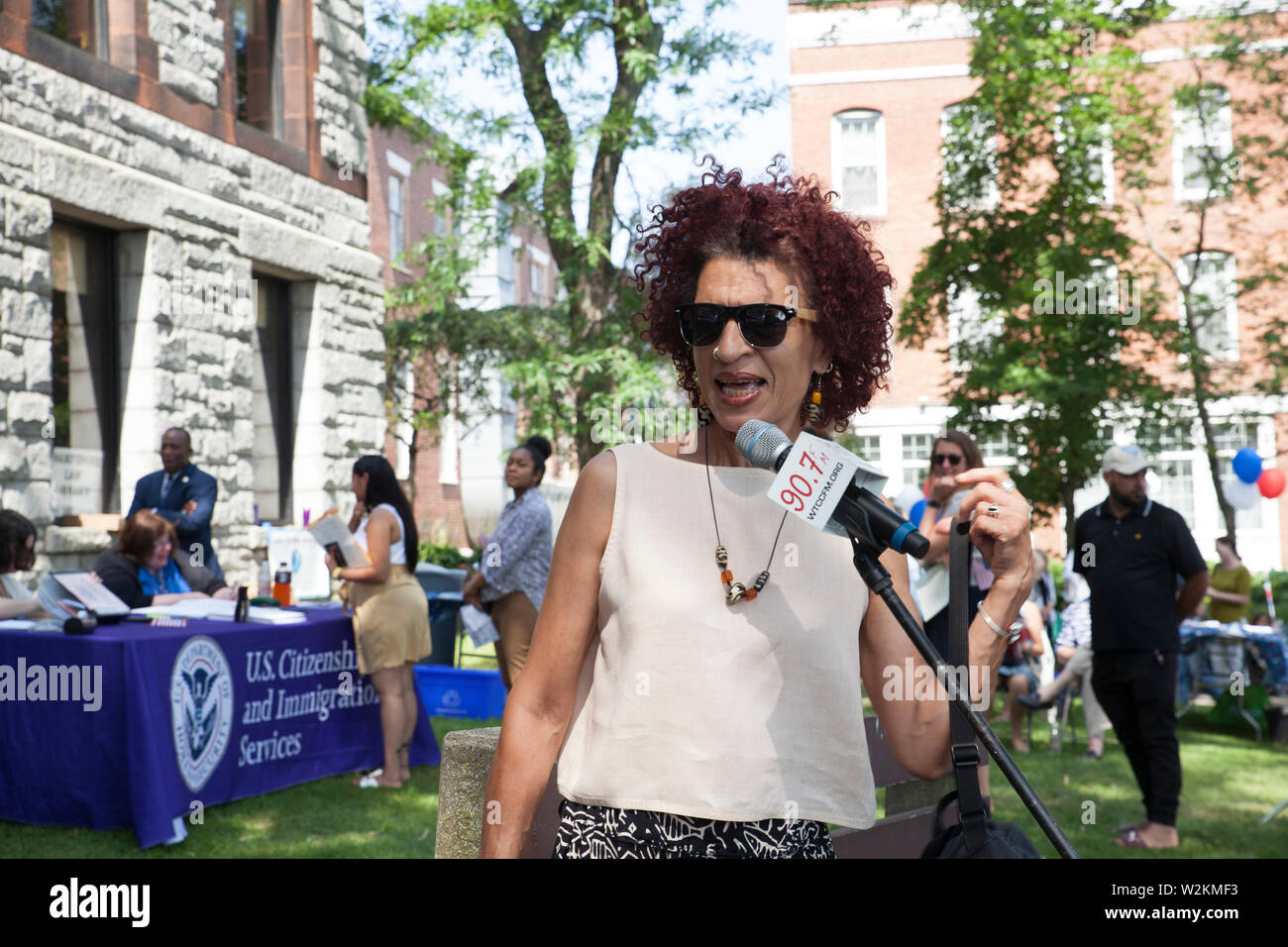 Evelyn Harris sings for mike check before Naturalization ceremony on ...