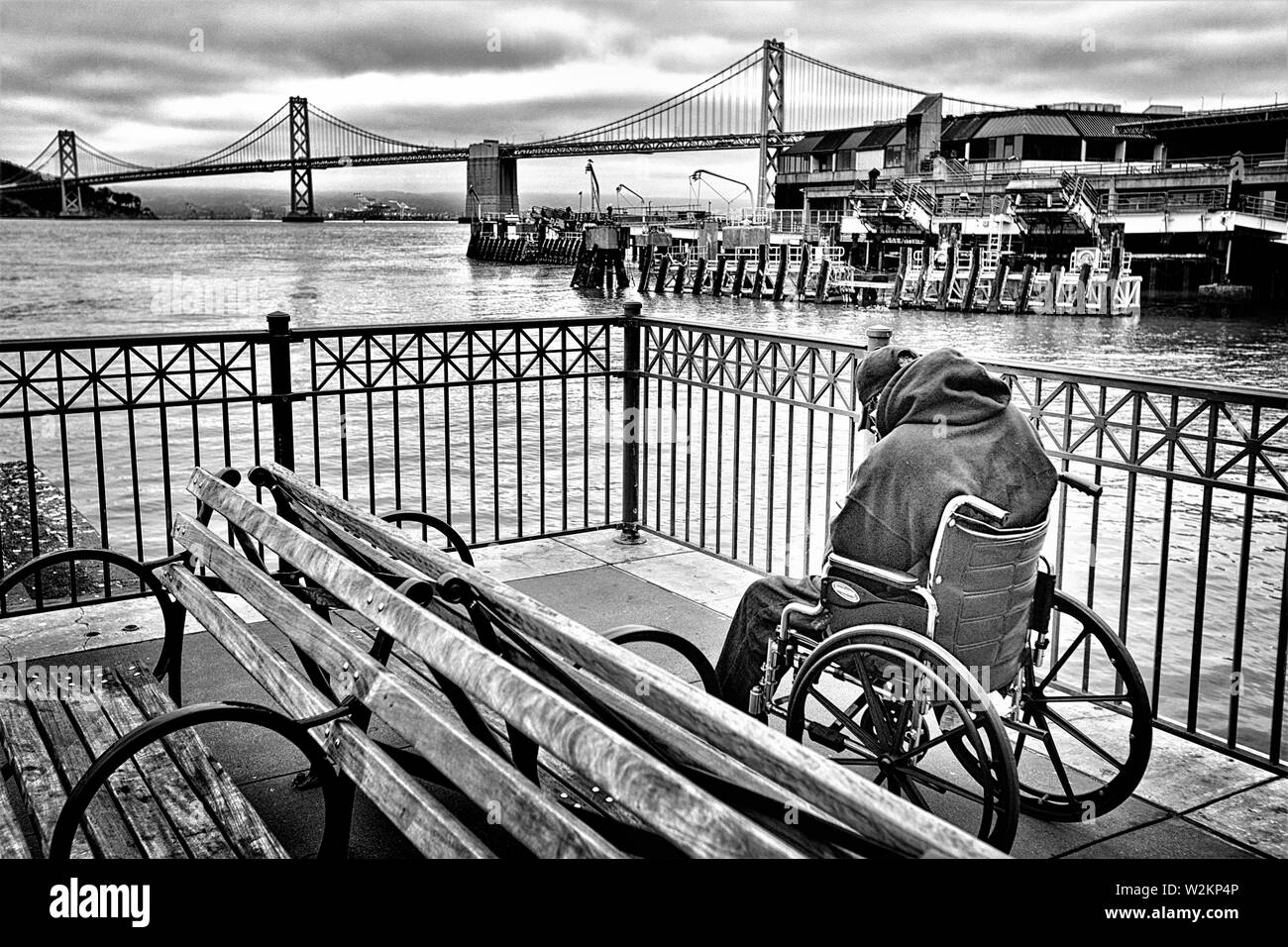 Old senior real man on a dock in San Francisco who is disabled and ...