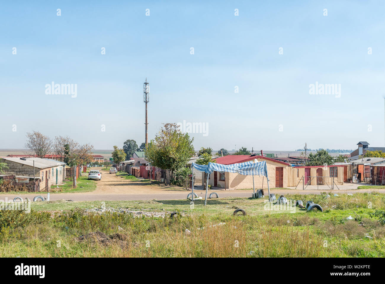 BETHAL, SOUTH AFRICA - MAY 2, 2019: A street scene, with houses and a ...