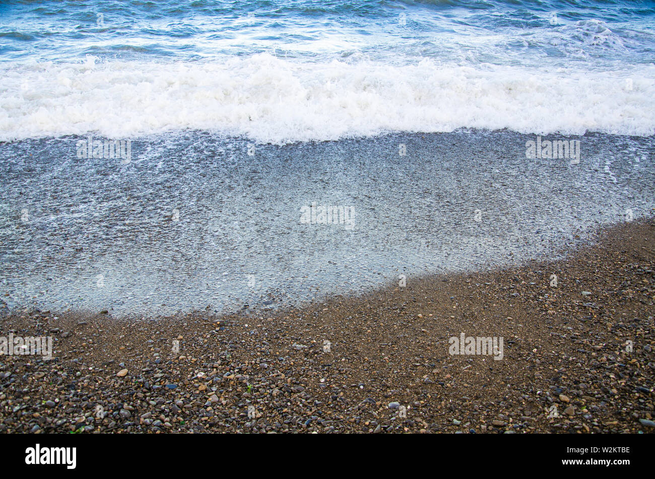 Colorful seascape, view of sea waves on beach close up Stock Photo - Alamy