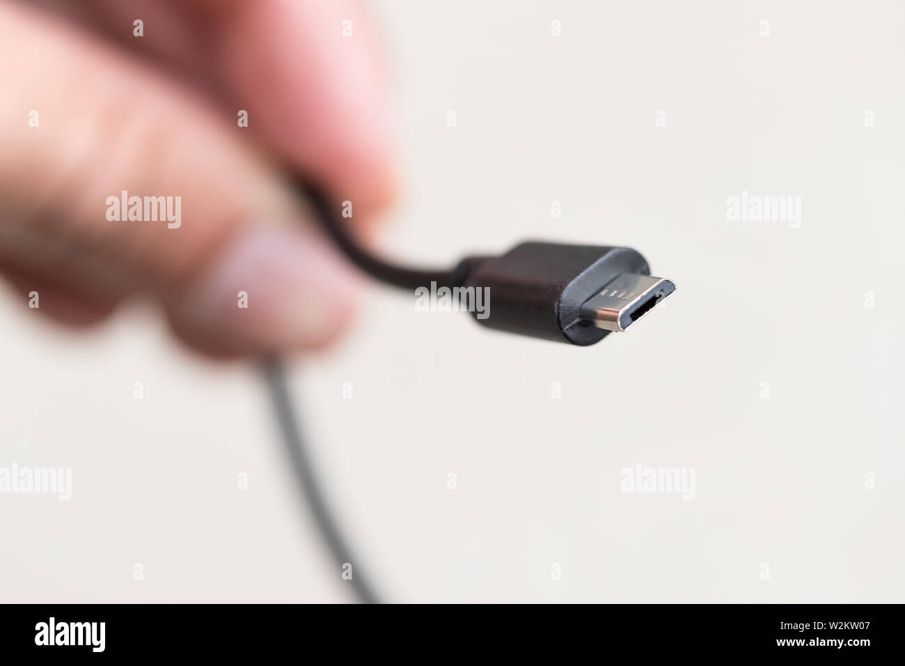 single usb cable connection typ c in hand Stock Photo - Alamy