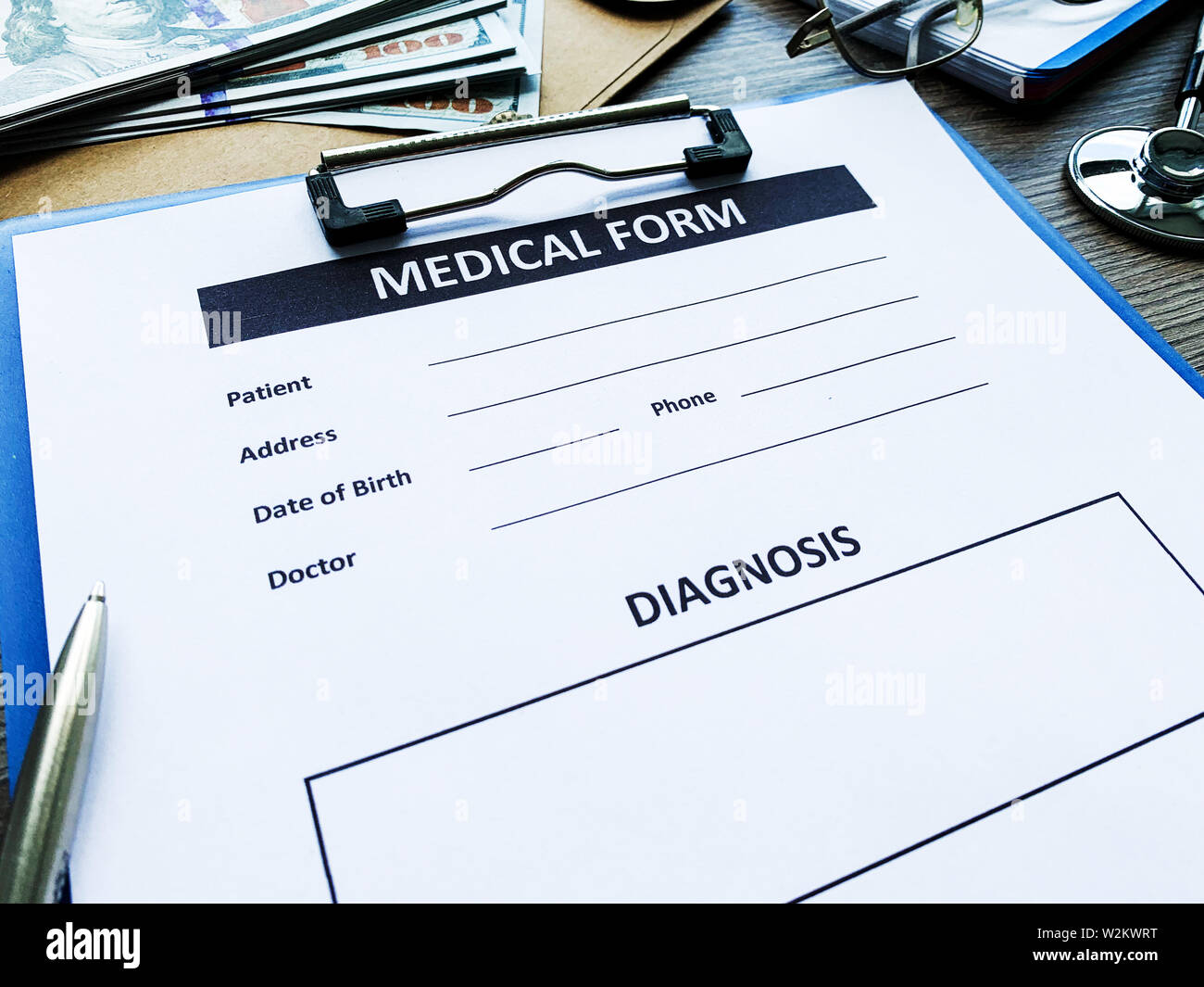 Medical form with patient data on doctor's desk Stock Photo - Alamy