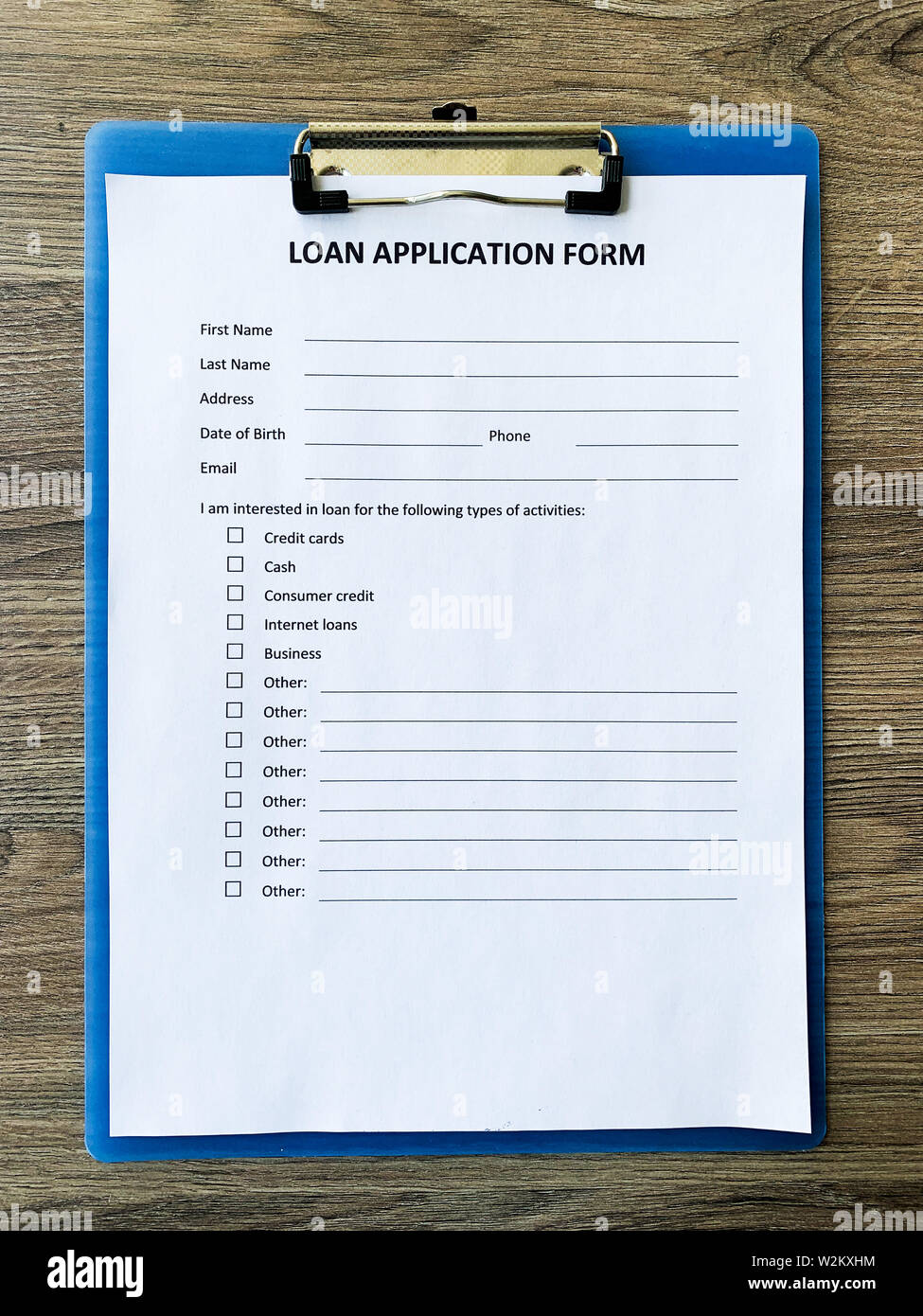 Loan application form document with graph on table Stock Photo - Alamy