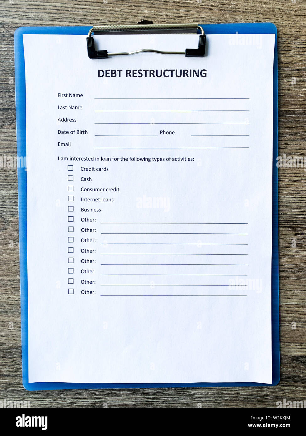 Debt restructuring document with graph on table Stock Photo - Alamy