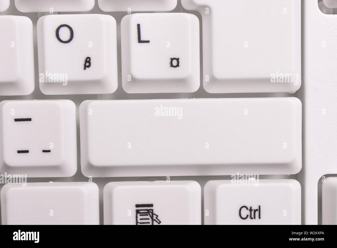 White pc keyboard with empty note paper above white background key copy ...