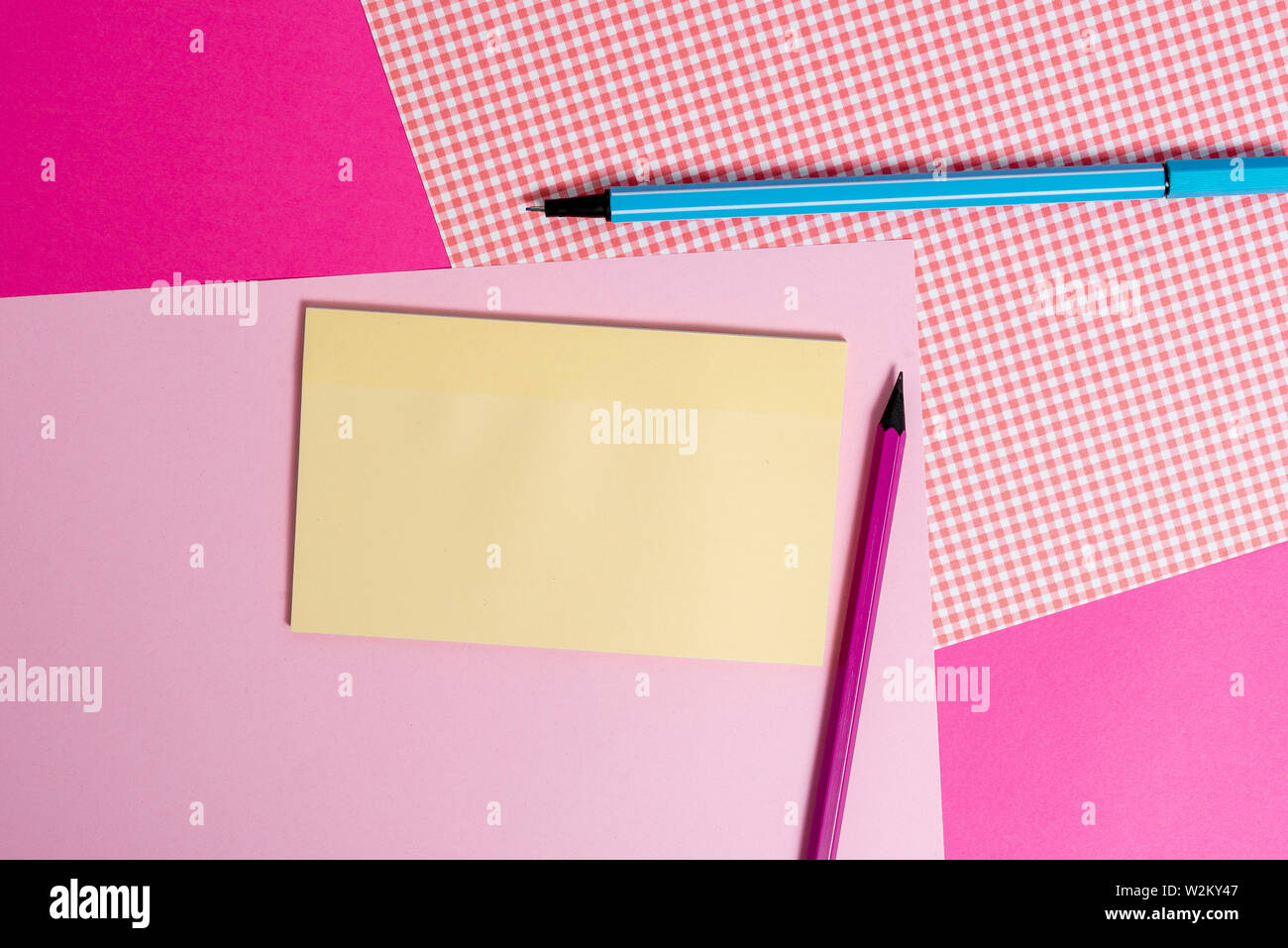 writing equipments with stationary and plain note paper placed on the ...