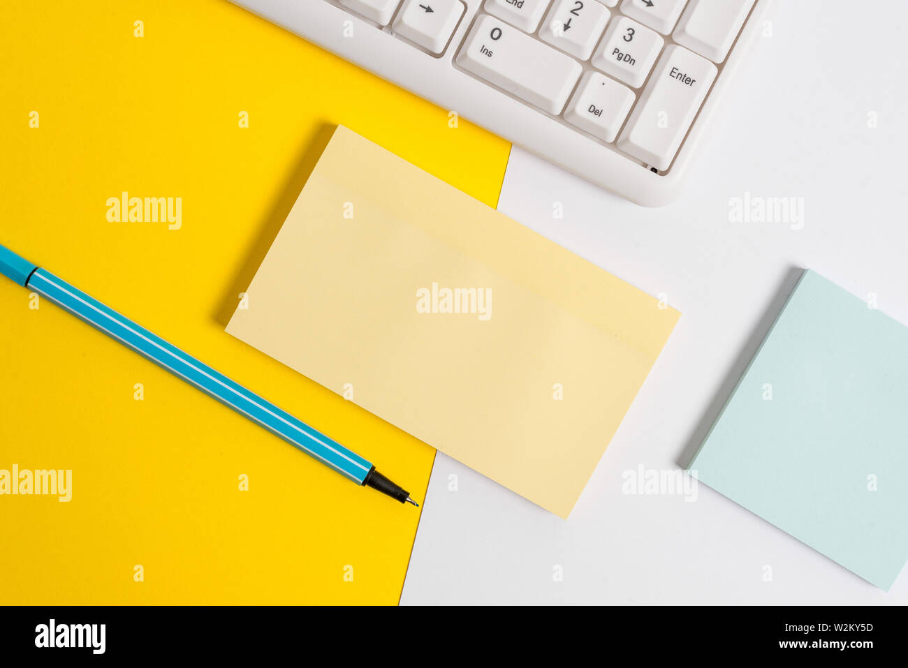 Empty blank paper with copy space and pc keyboard above orange ...