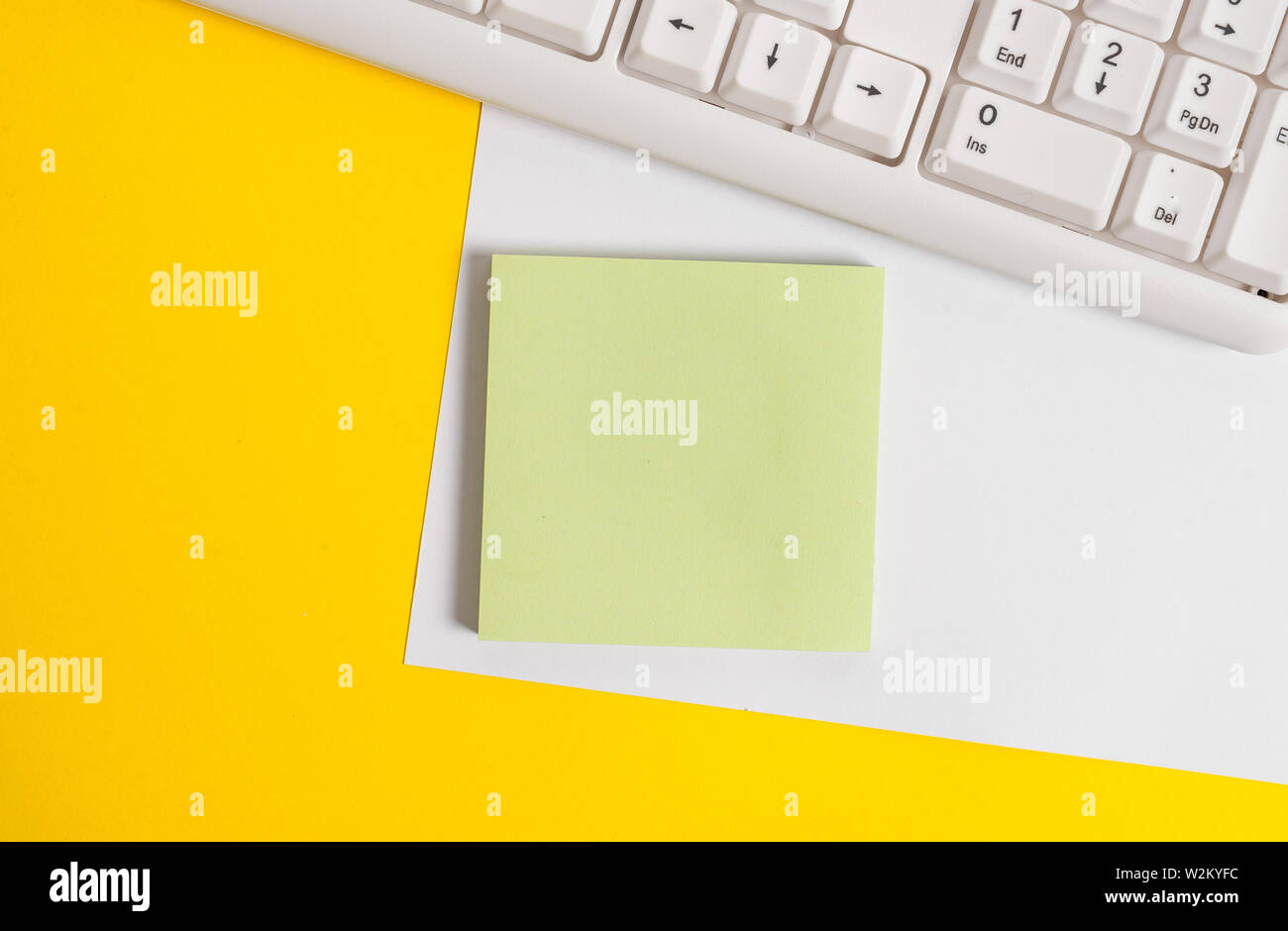 Empty blank paper with copy space and pc keyboard above orange ...