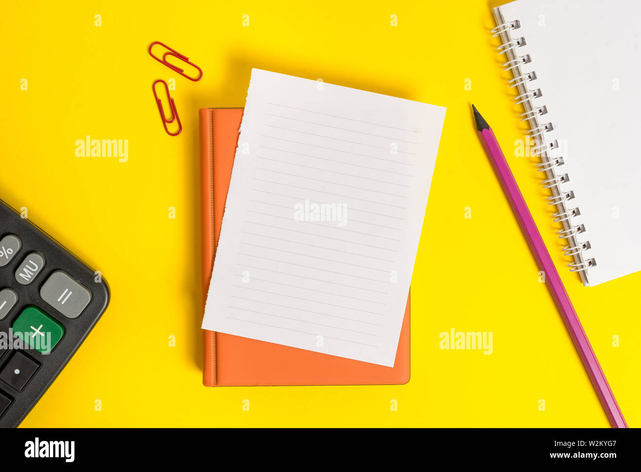 Pile of empty papers with copy space on the table. Paper clips with ...