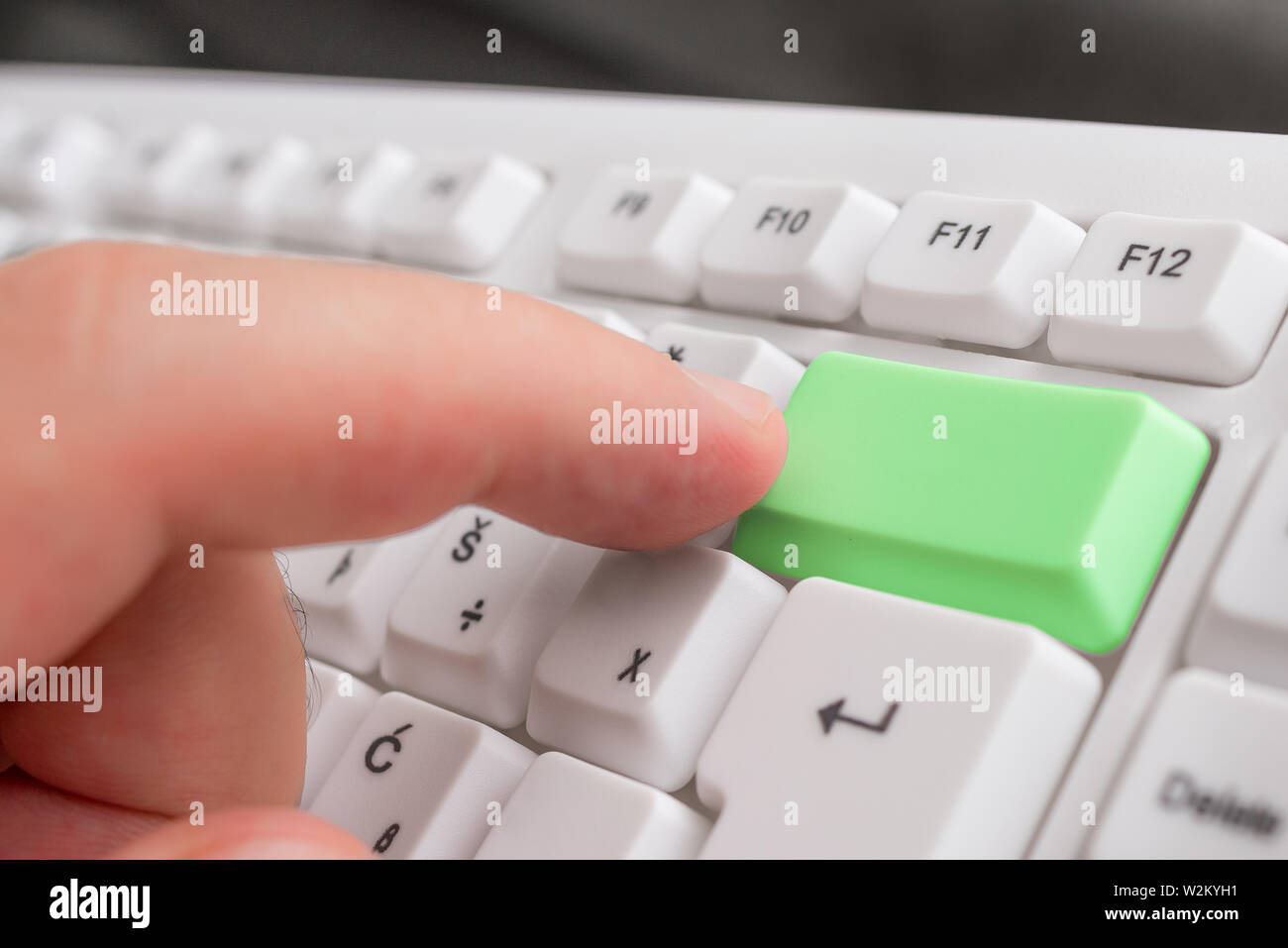 White pc keyboard with empty note paper above white background key copy ...