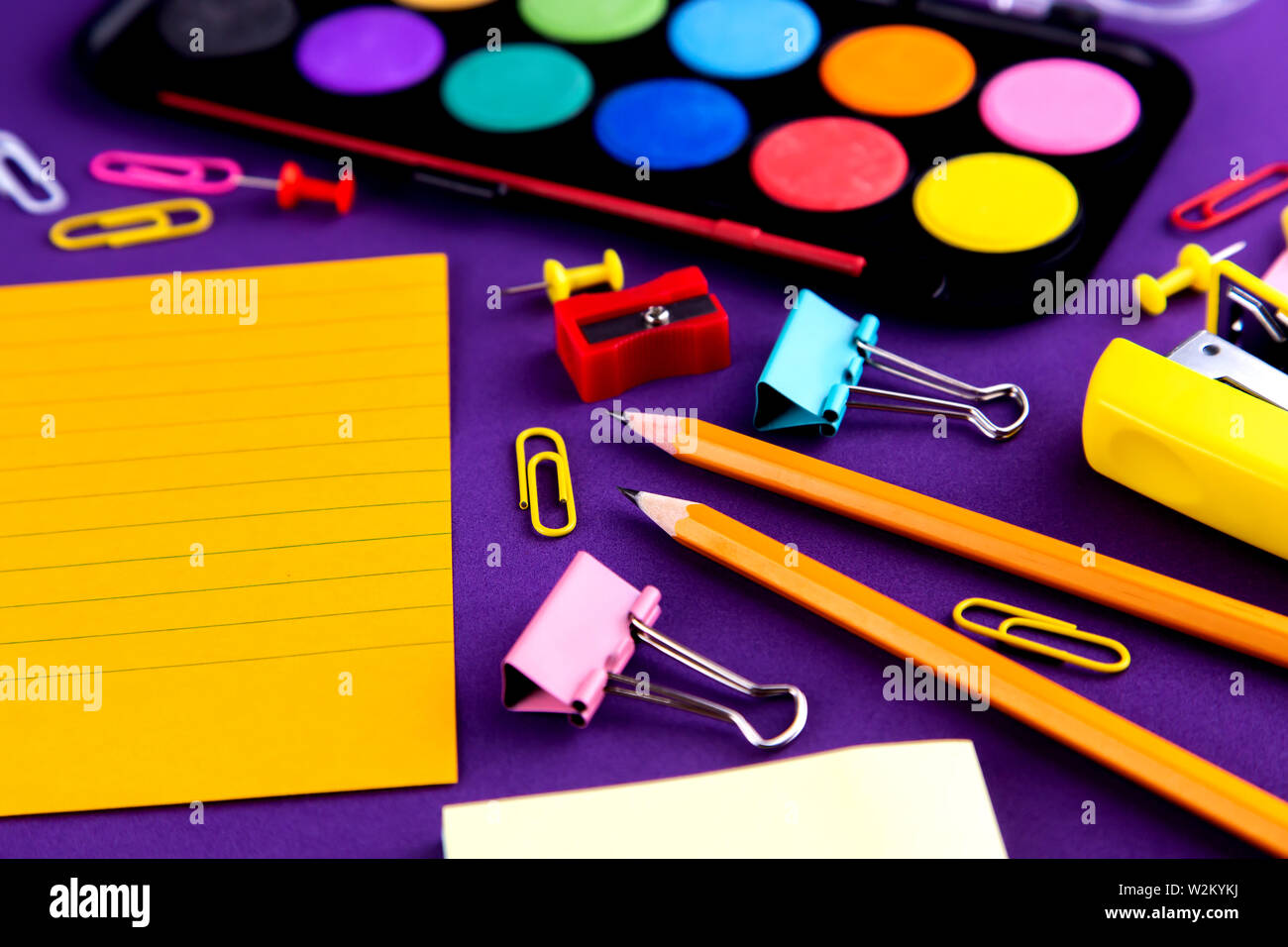 School office supplies stationery on a purple background desk with copy ...