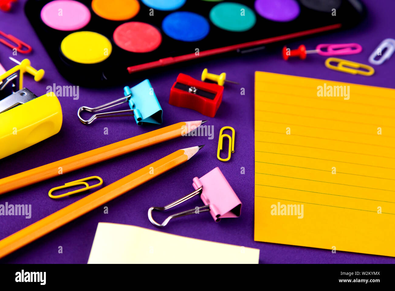 School office supplies stationery on a purple background desk with copy ...