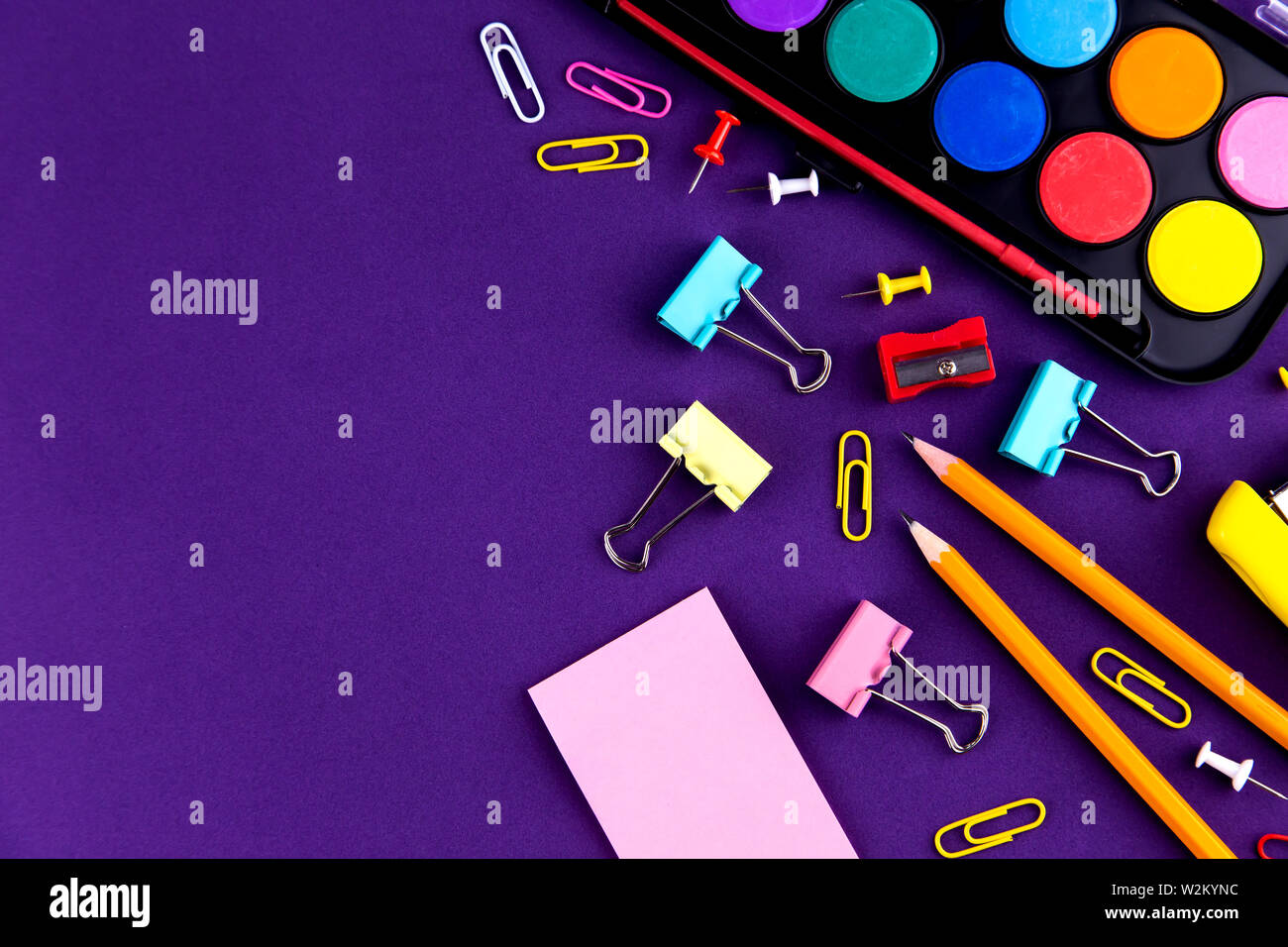 School office supplies stationery on a purple background desk with copy ...