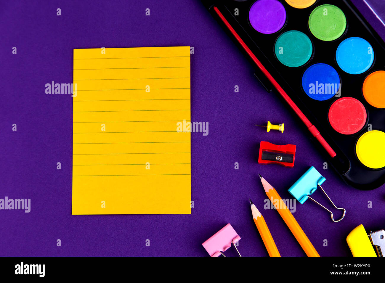 School office supplies stationery on a purple background desk with copy ...