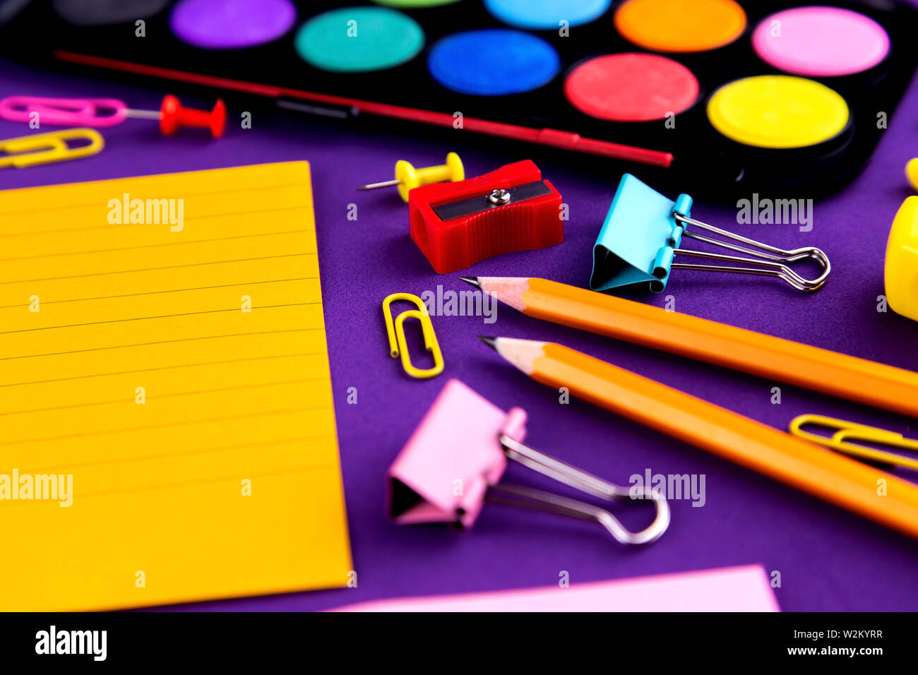 School office supplies stationery on a purple background desk with copy ...