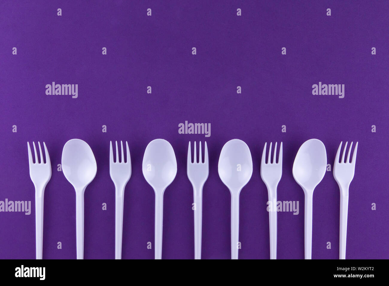 Single-use plastic objects, ecological pollution. Plastic waste. Orange ...