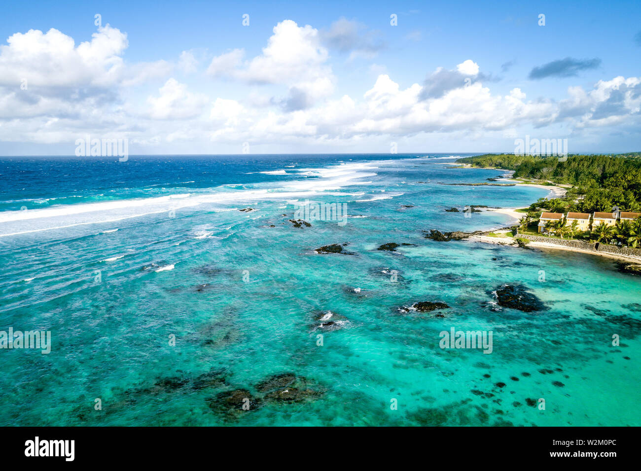 Aerial drone view at luxury resorts and coastline at Belle Mare beach ...