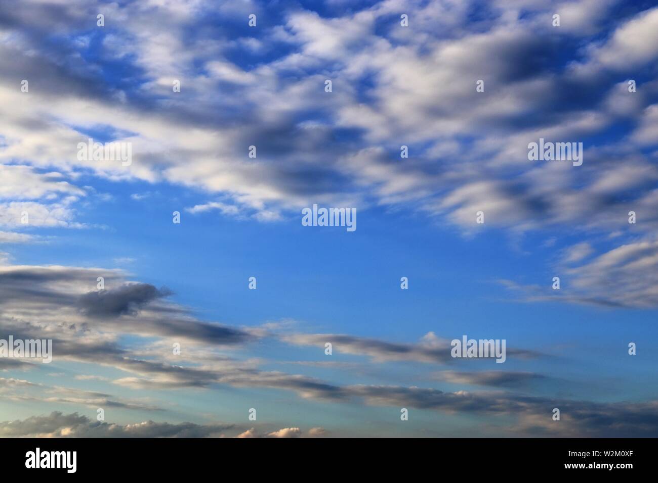 Stunning mixed cloud formations on a blue sky taken in Europe Stock ...
