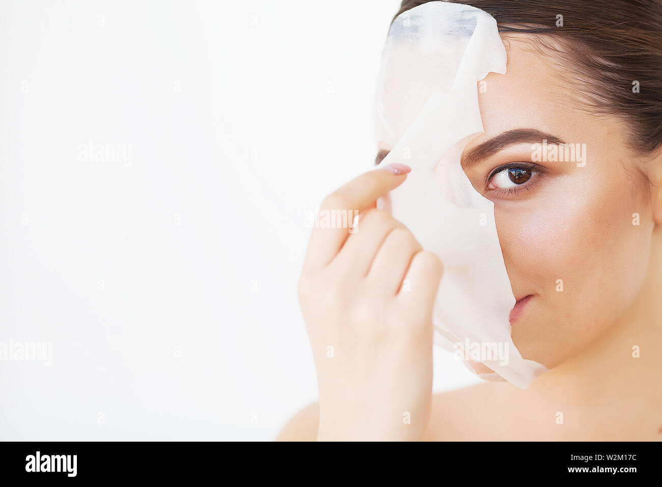 Skin Care. Beautiful Girl With Sheet Mask on Her Face Stock Photo - Alamy