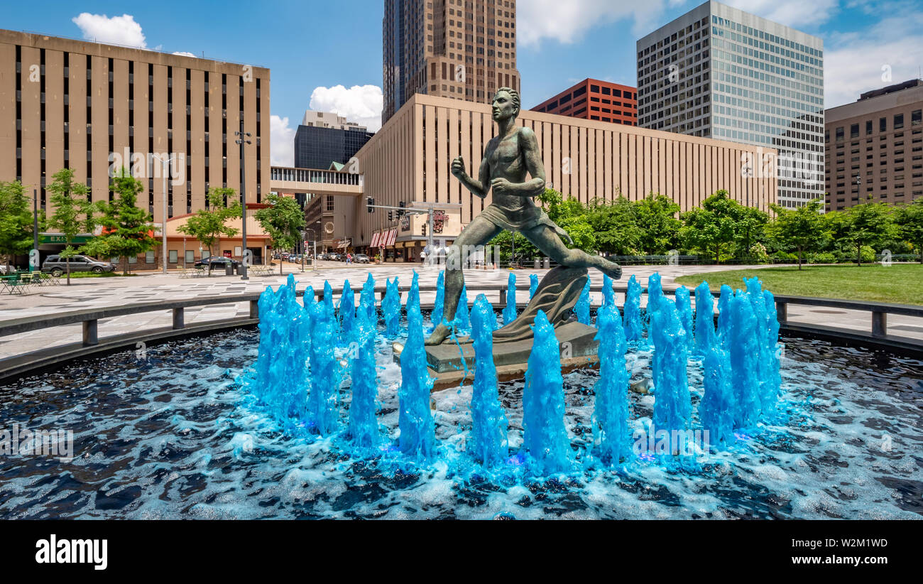 Blue water fountain with Runner Statue at Kiener Plaza Park in St ...