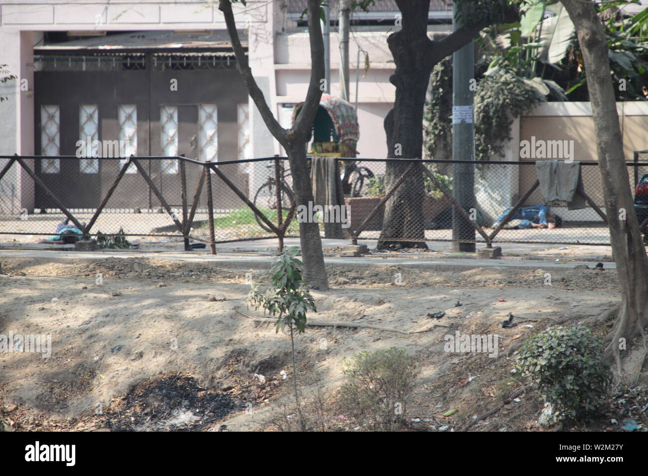 Two bodies lie on road 3A, Dhanmondi. Sniper fire prevented the bodies ...
