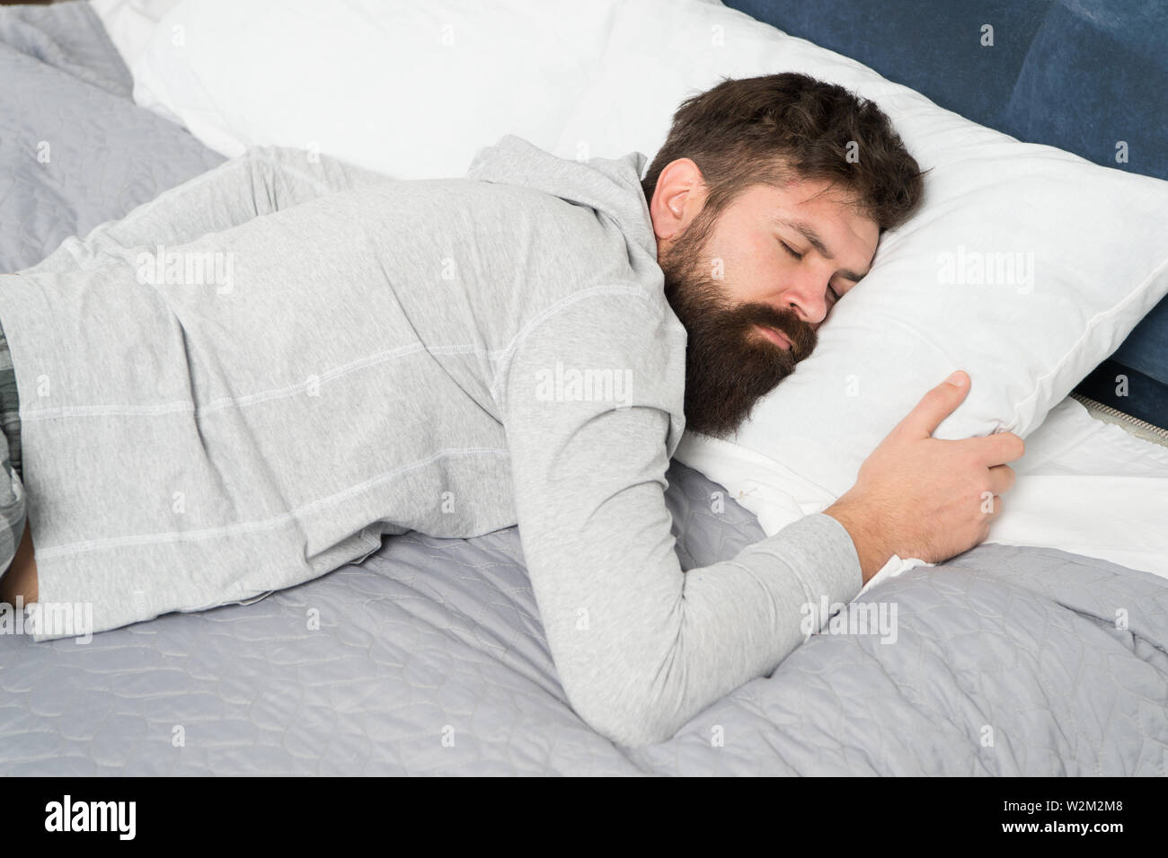 Sleep wake homeostasis keeps track of your need for sleep. Man at home ...