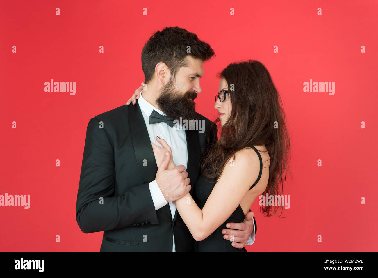Lets dance tonight. Elegant couple in love tender hug dancing red ...