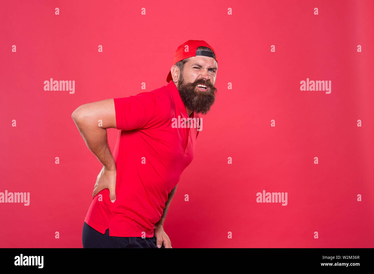My back hurts. Man painful face touches lower back. Problems with ...