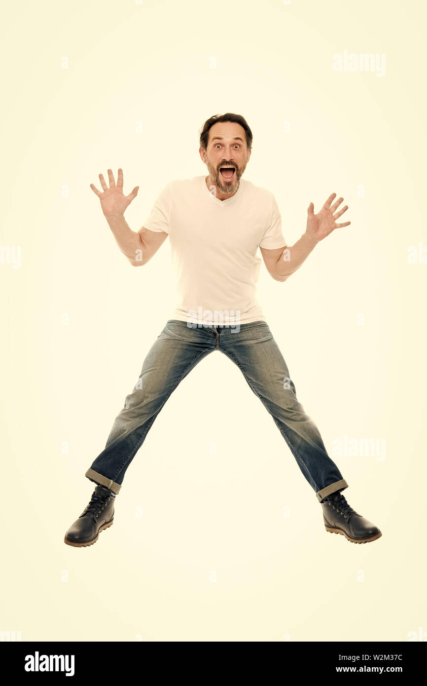 Man excited jumping. Mature charismatic speaker excited to inform. Full ...