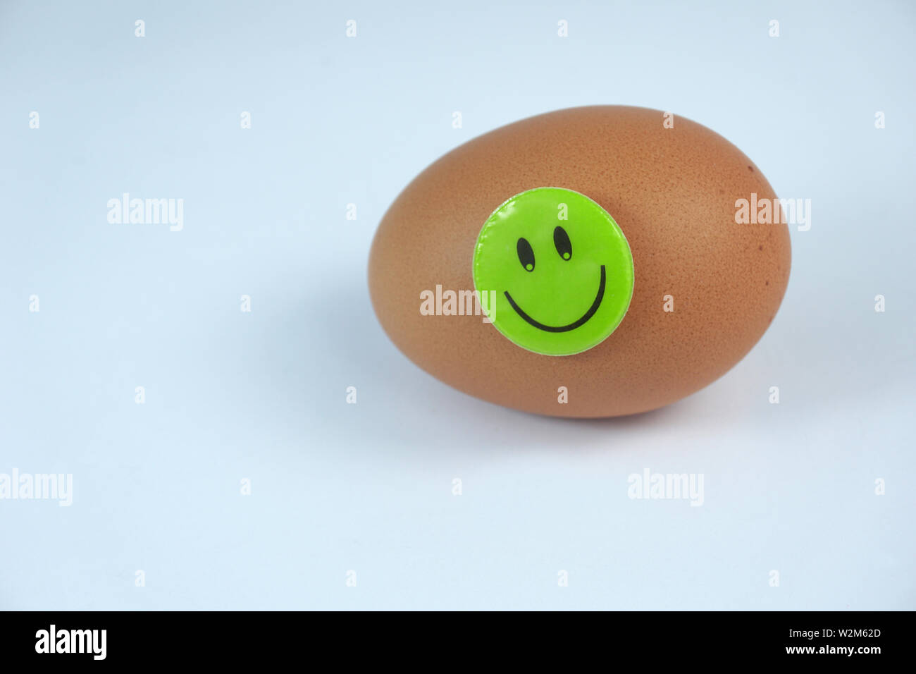 Fresh food, brown egg, garlic, red tomato, almonds Healthy Smiley Happy ...