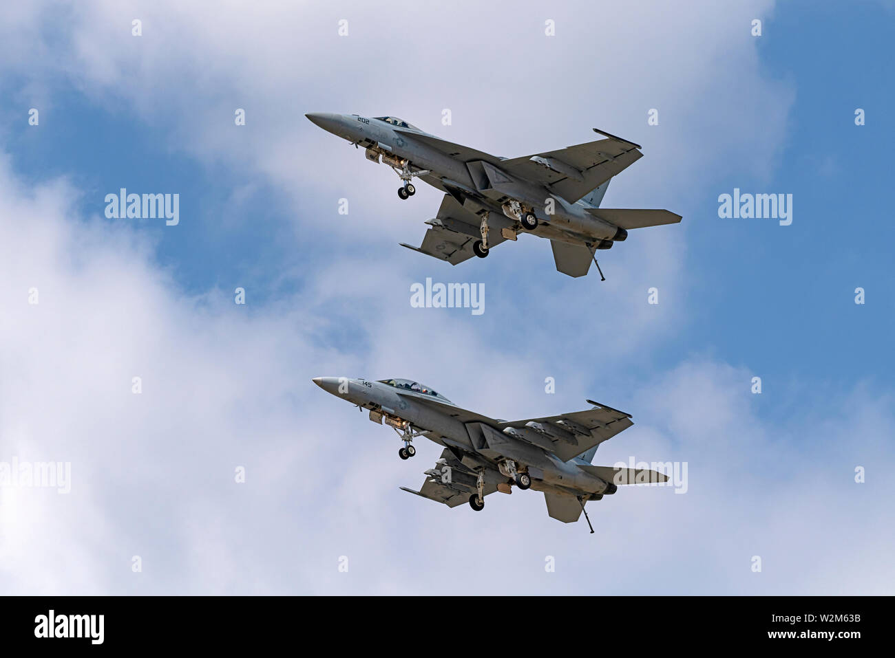 Airplanes pair of F-18 Hornet jets flying Stock Photo - Alamy