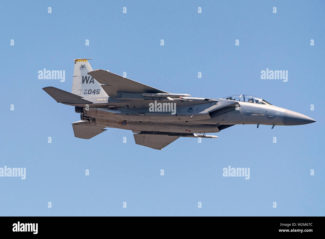 Jet F-15 Eagle military fighter flying above the California desert ...